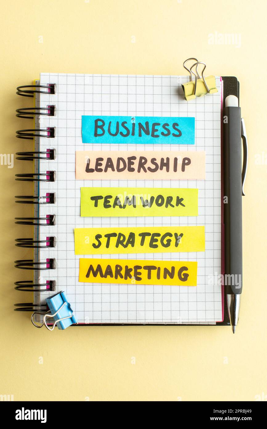 top view different business terms on little stickers in notepad light ...
