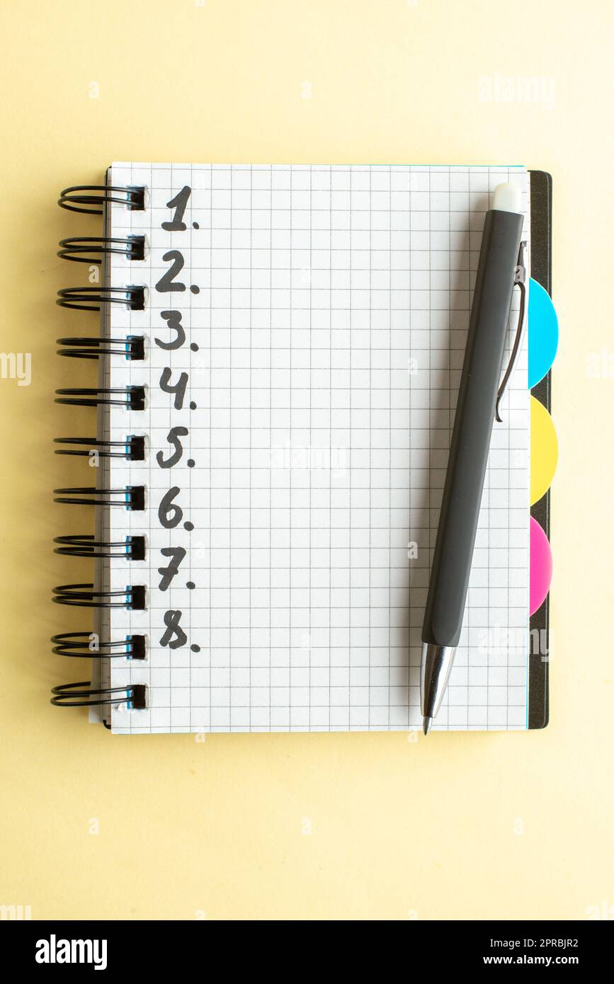 top view open notepad with numbers and pen on light background worker ...