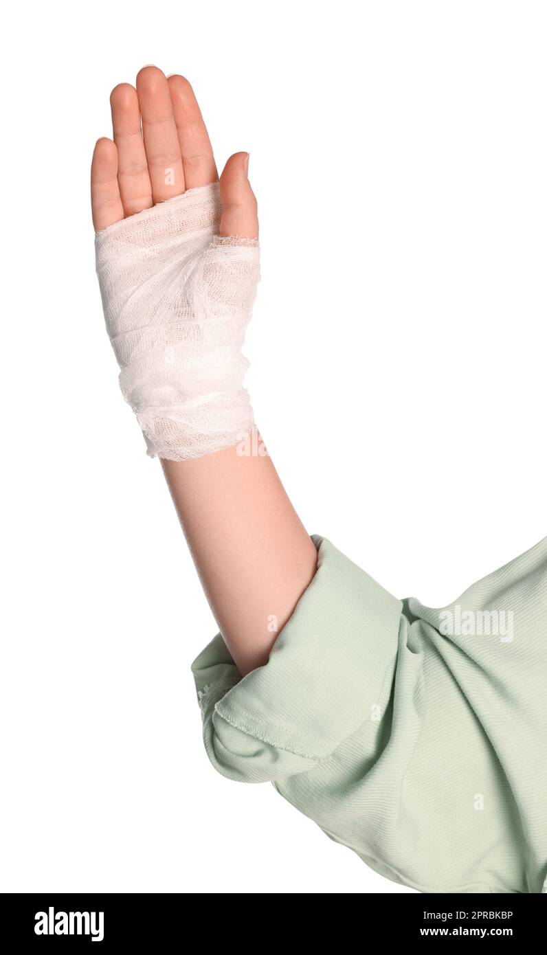 Woman with hand wrapped in medical bandage on white background, closeup ...
