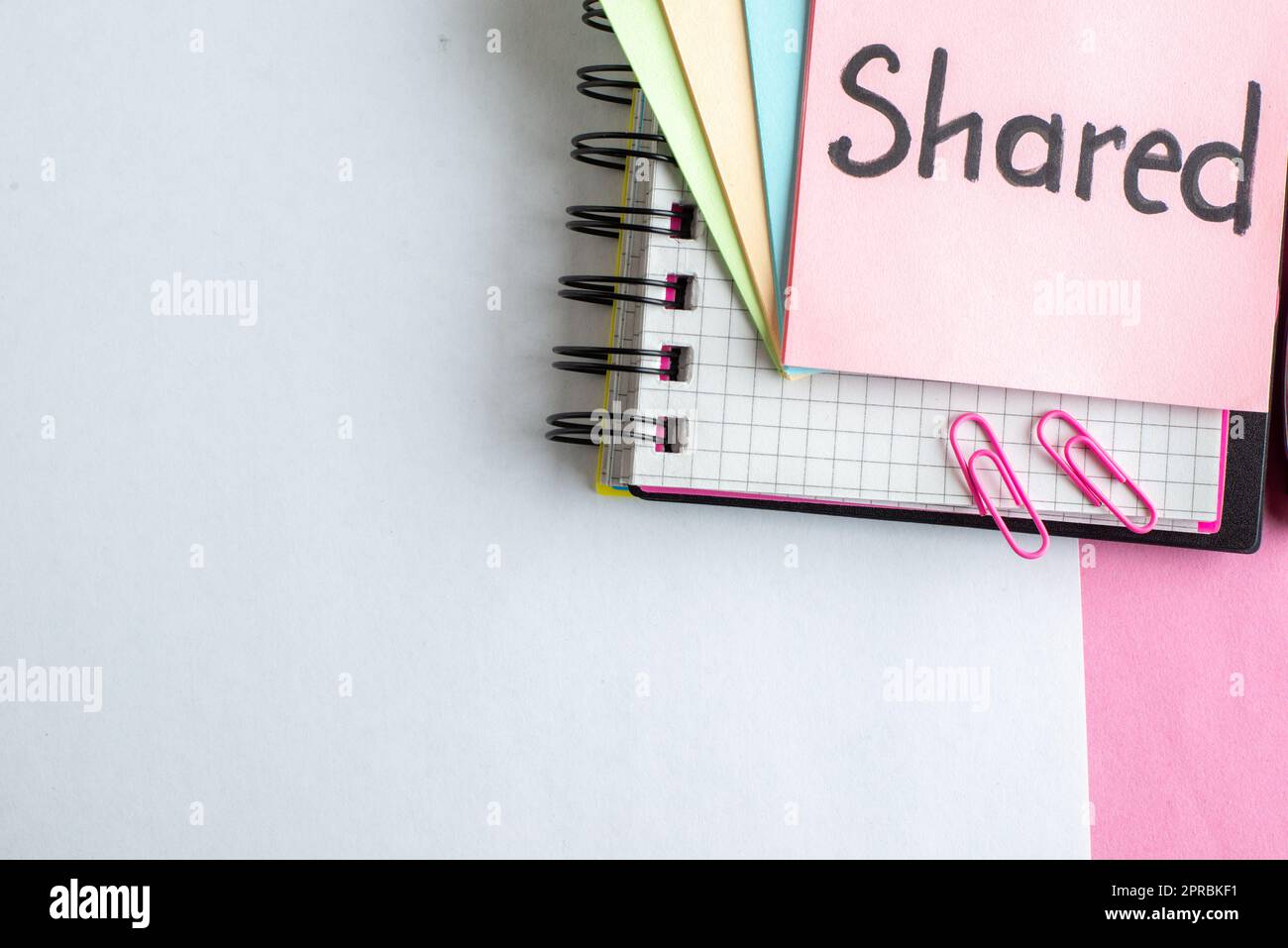 Top View Shared Written Note With Stickers On White-pink Background