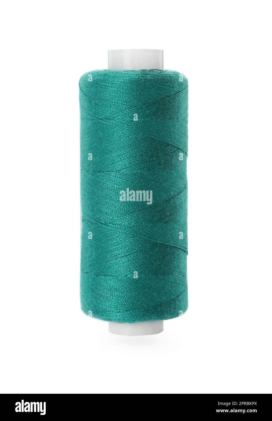 Spool of green sewing thread isolated on white Stock Photo - Alamy