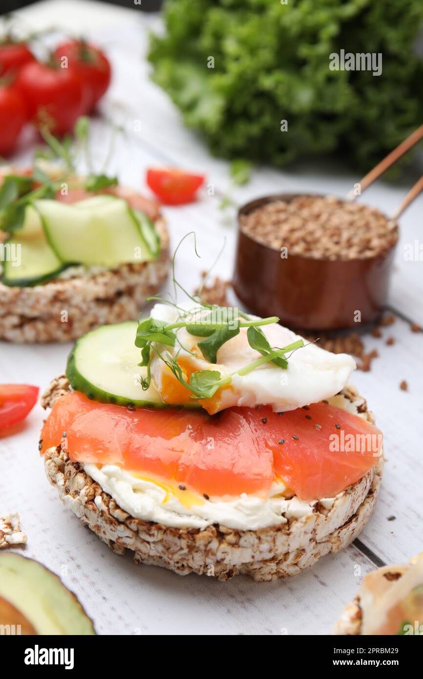 Crunchy buckwheat cakes with salmon, poached egg and microgreens on ...