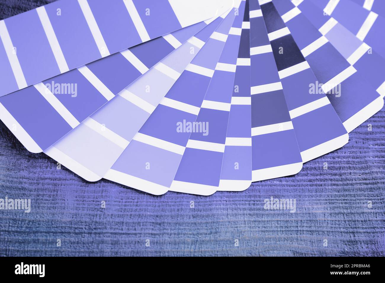 Color palette samples of violet shades on wooden background, closeup ...