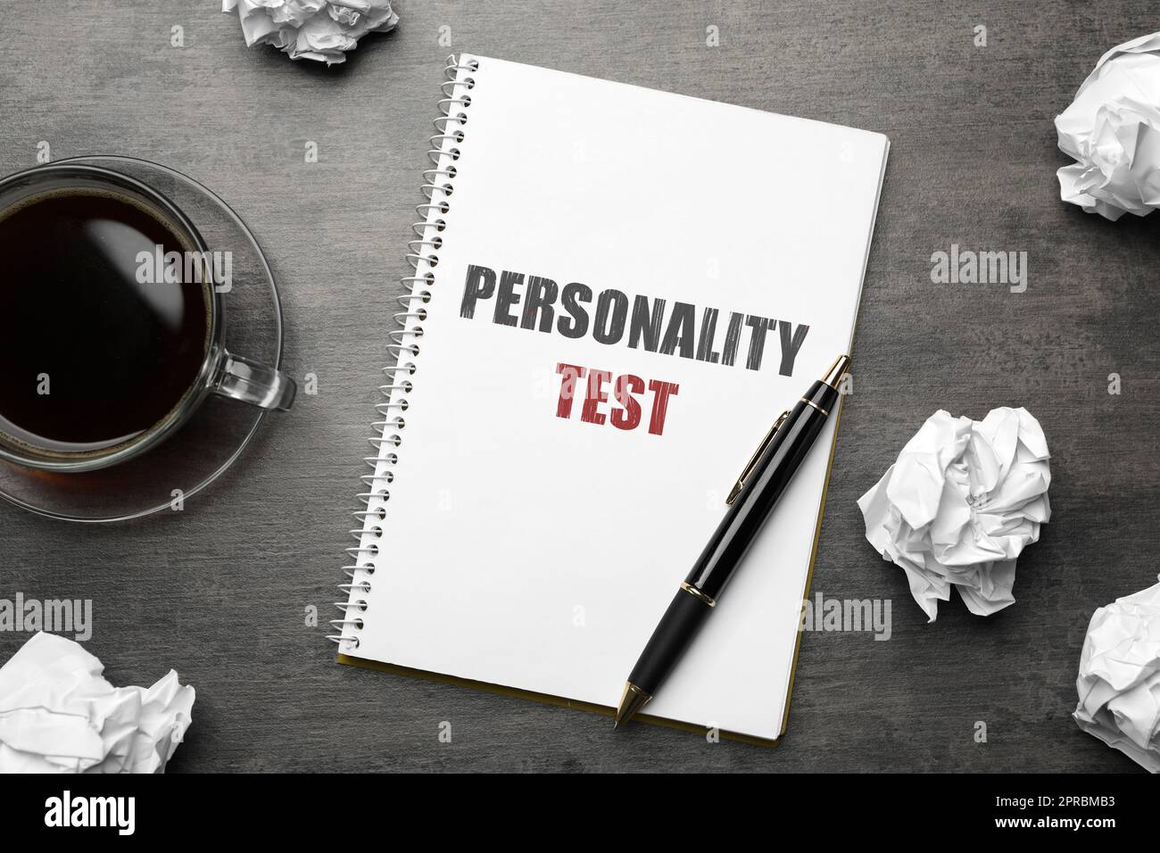 Notebook with text Personality Test, pen and crumpled sheets of paper ...