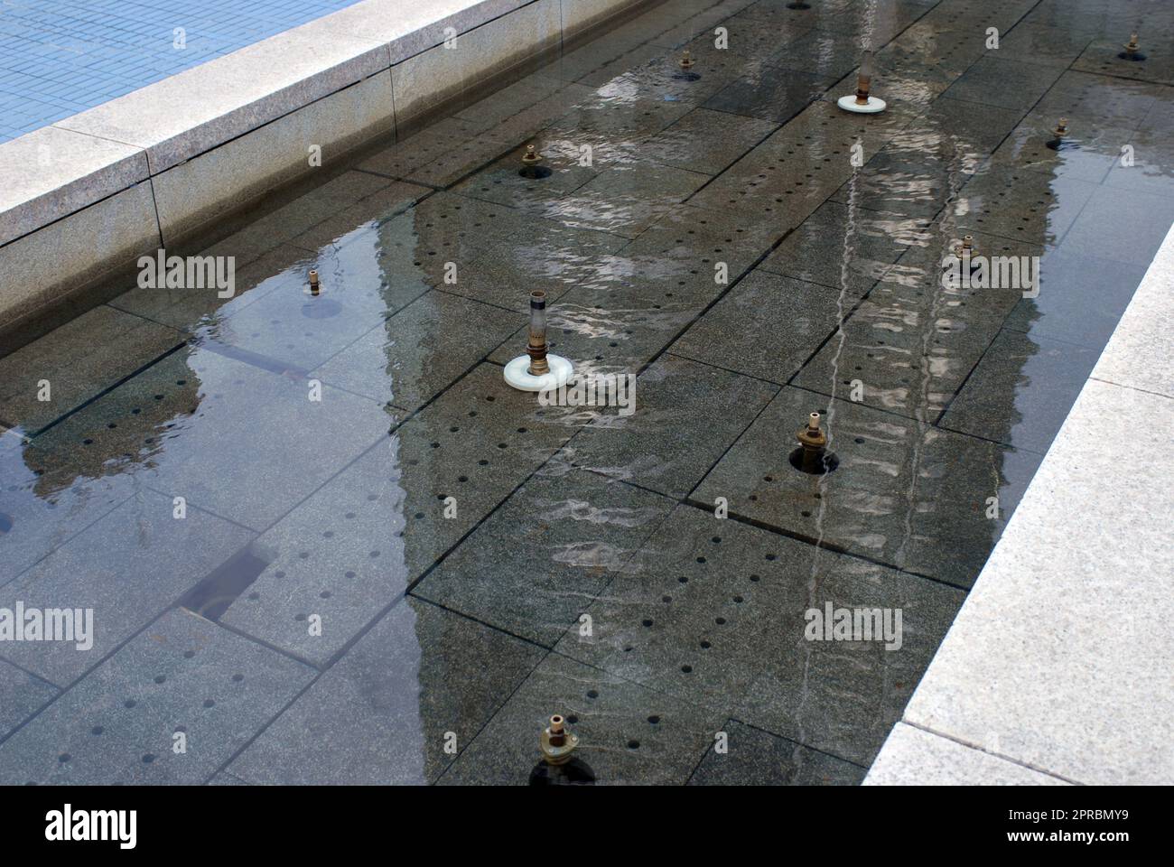 Reflection in drained fountain of Petronas Twin Towers, Kuala Lumpur ...