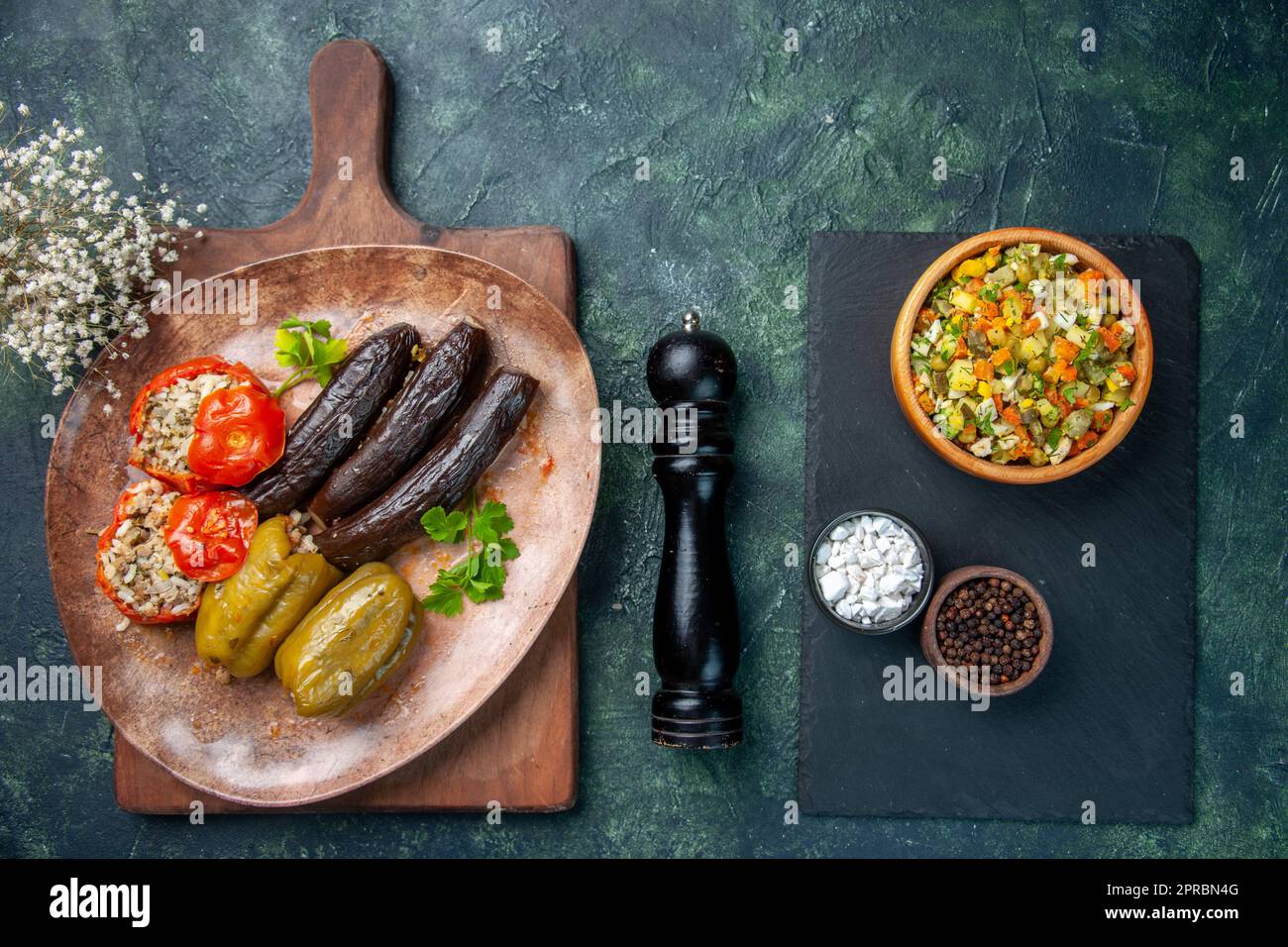 top view tasty vegetable dolma with black pepper shaker on dark blue ...