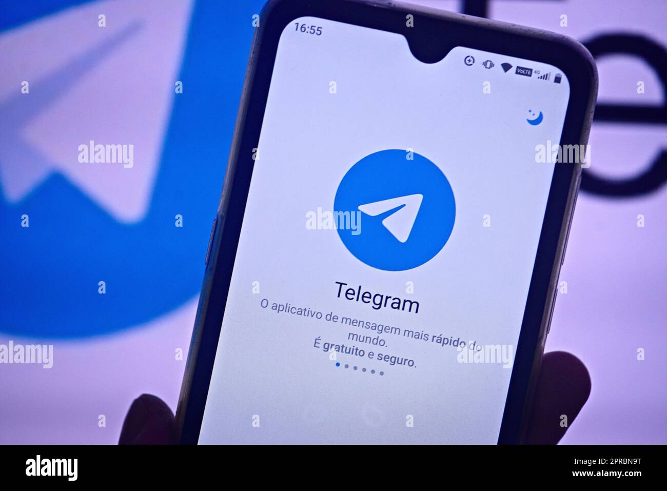 Hand holding a smartphone with telegram social network service on the ...