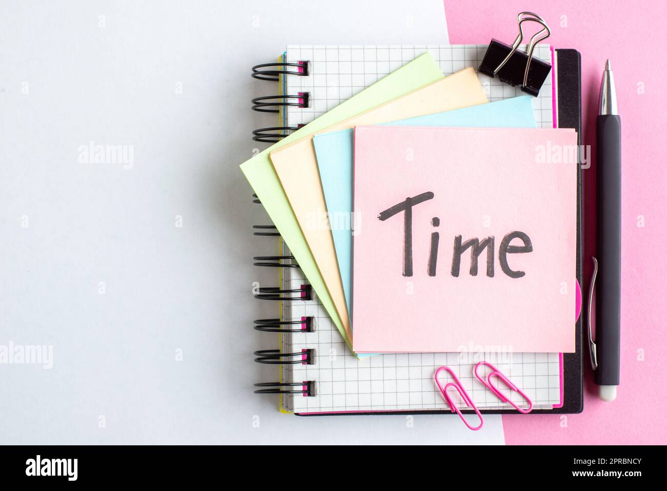 top view time written note with stickers on white-pink background job ...