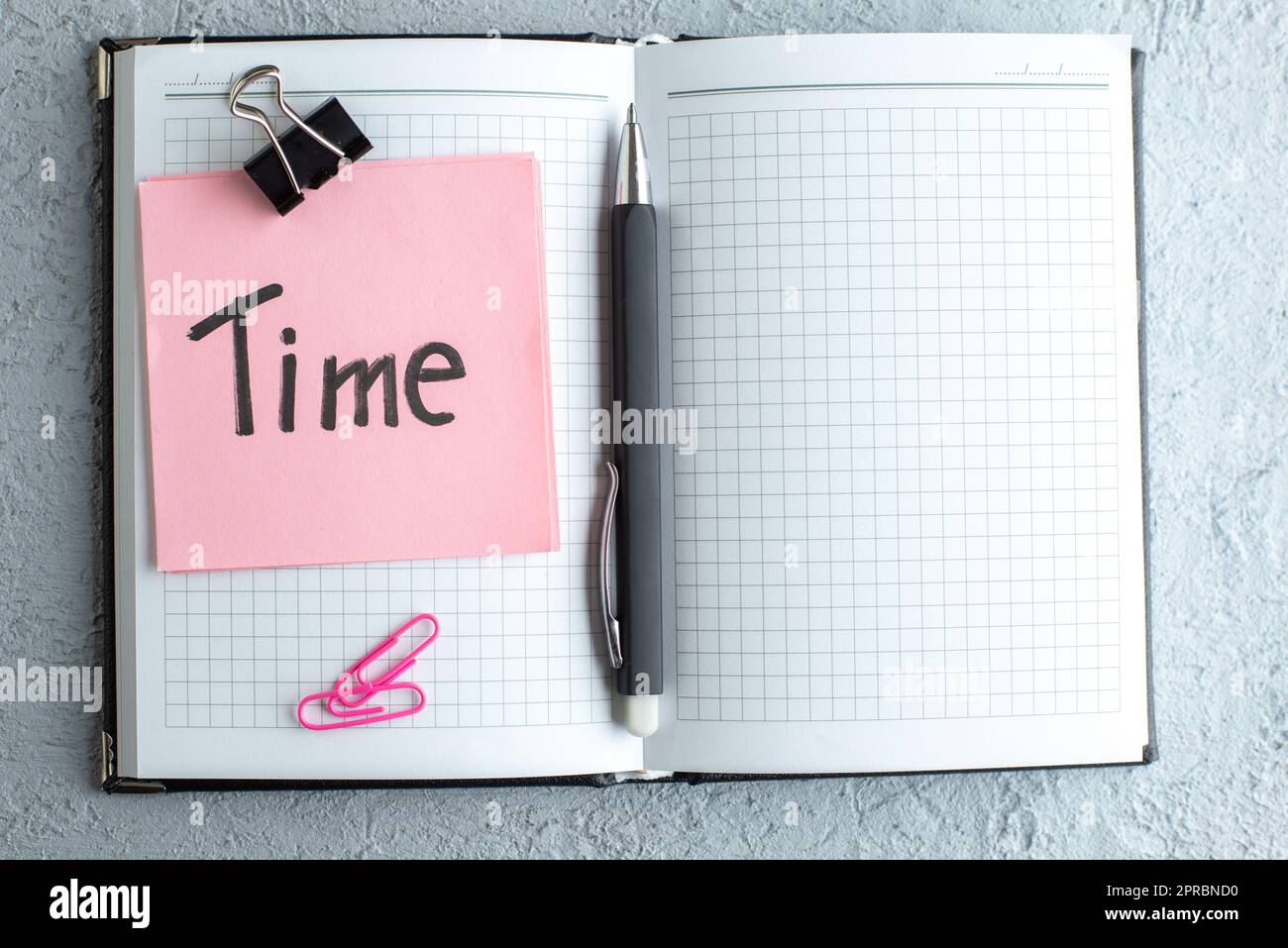 top view time written note with notepad and pen on white background job ...