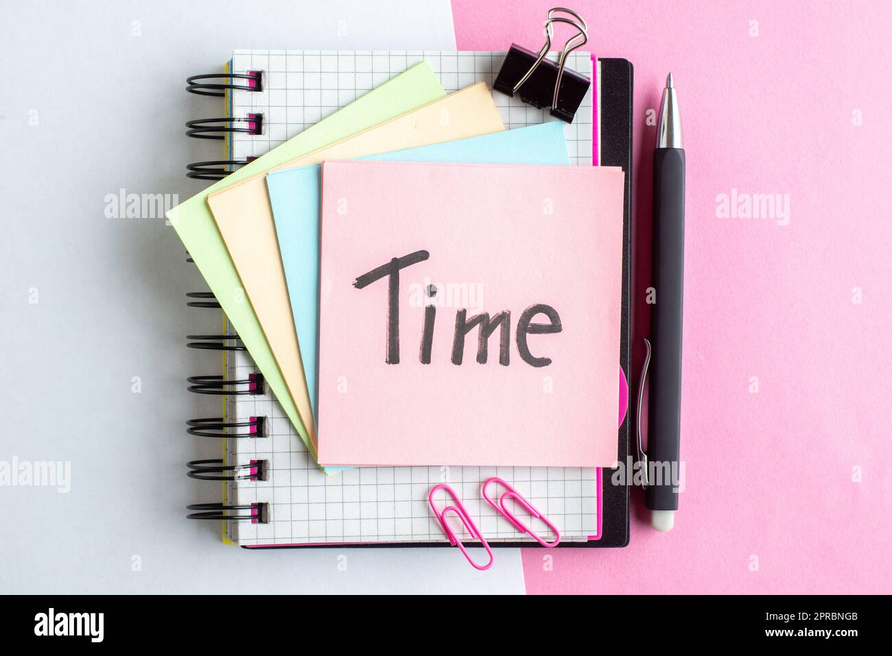 top view time written note with stickers on white-pink background job ...