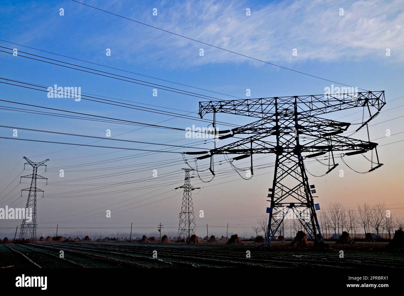 High voltage electric tower line Stock Photo - Alamy