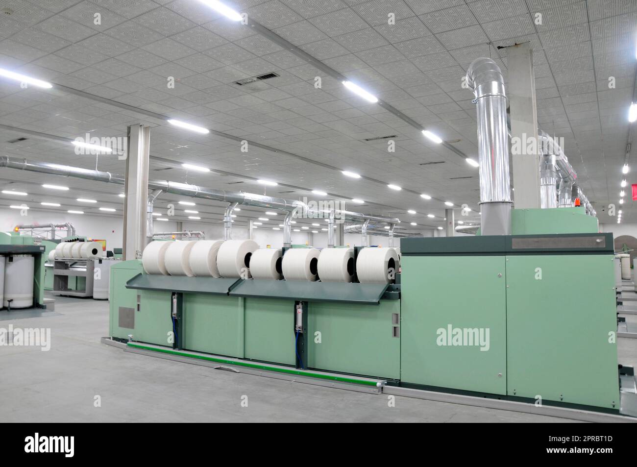Spinning mill equipment in the workshop Stock Photo - Alamy