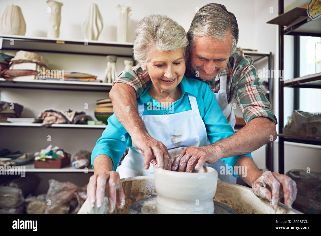 True love never grows old. a senior couple making a ceramic pot ...