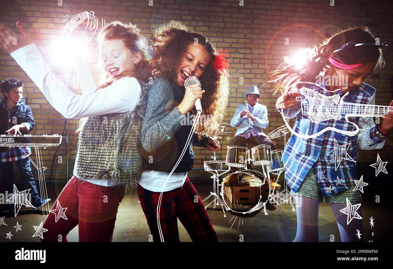 Having the time of their lives. children singing and playing rock music ...