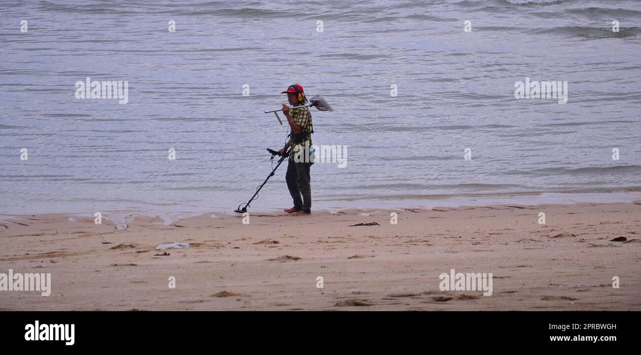 Person uses metal detector in hi-res stock photography and images - Alamy