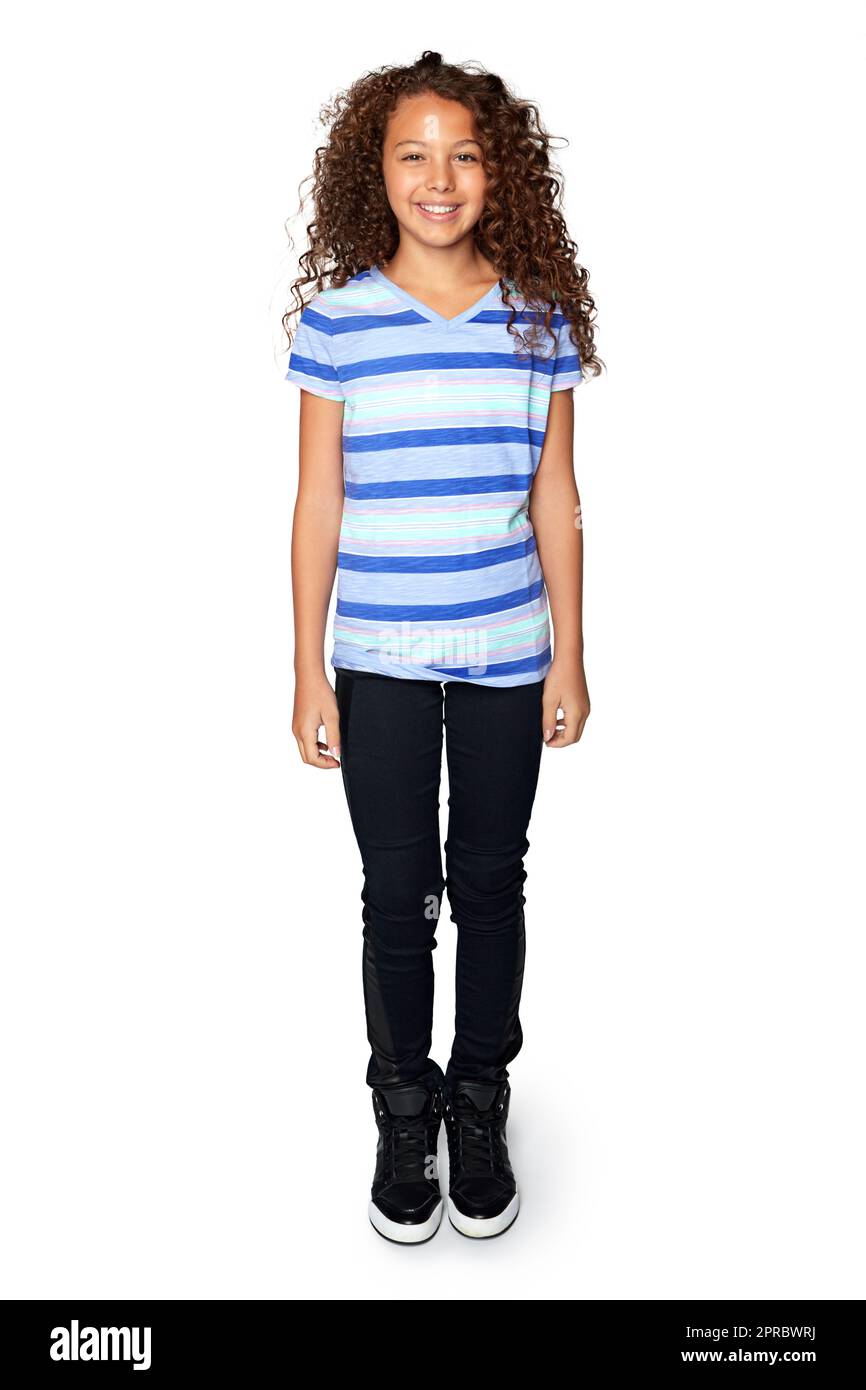 Curly haired cutie. Studio portrait of a young girl posing against a ...