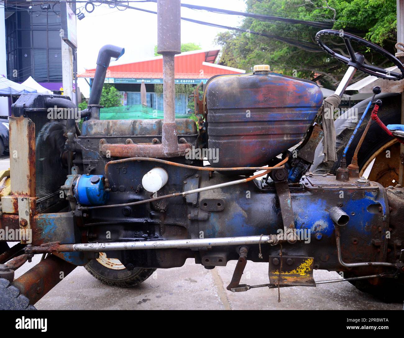 Engine of an old tractor in Thailand. A tractor is an engineering ...