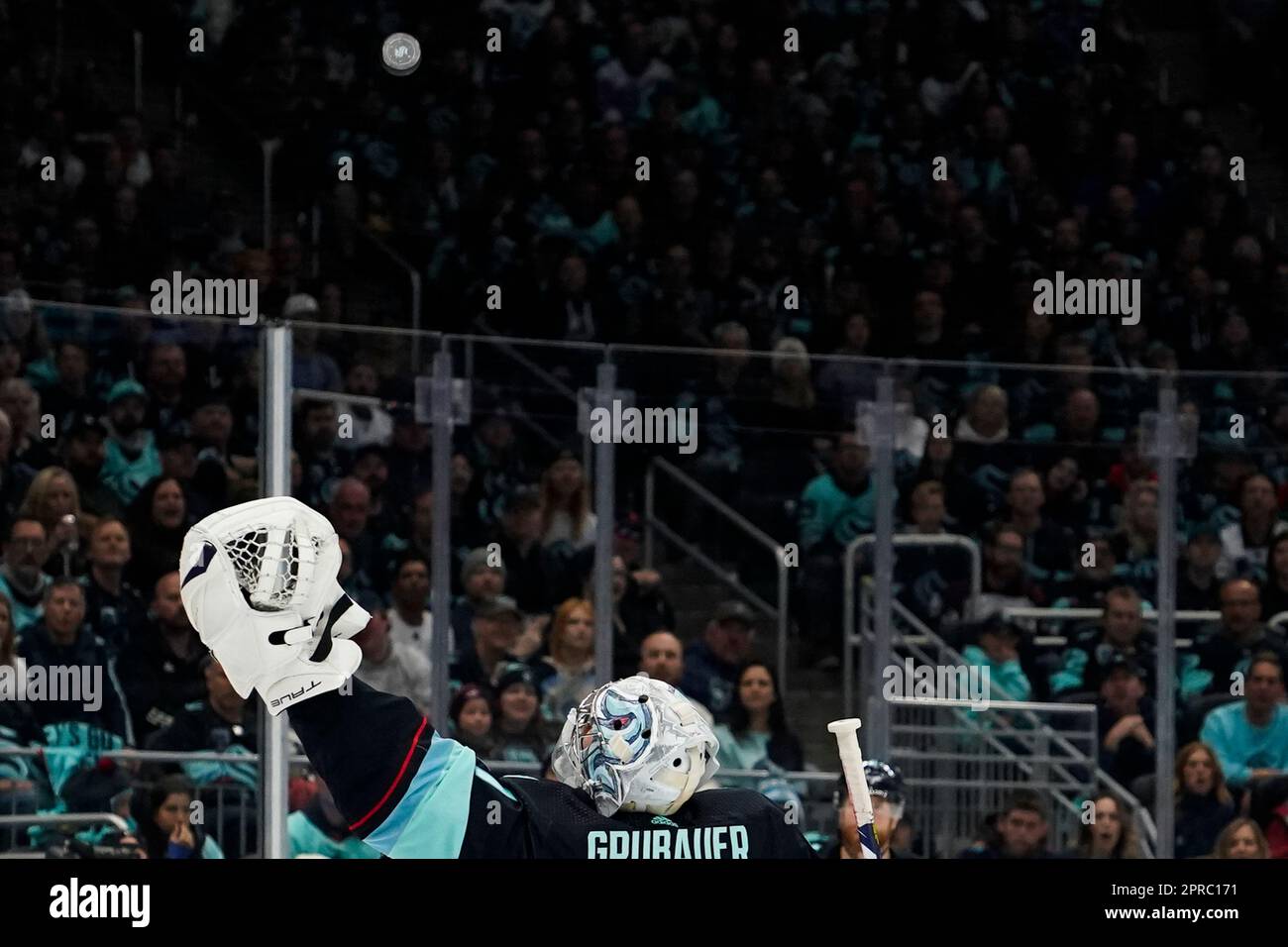 Seattle Kraken goaltender Philipp Grubauer (31) reaches for the flying ...