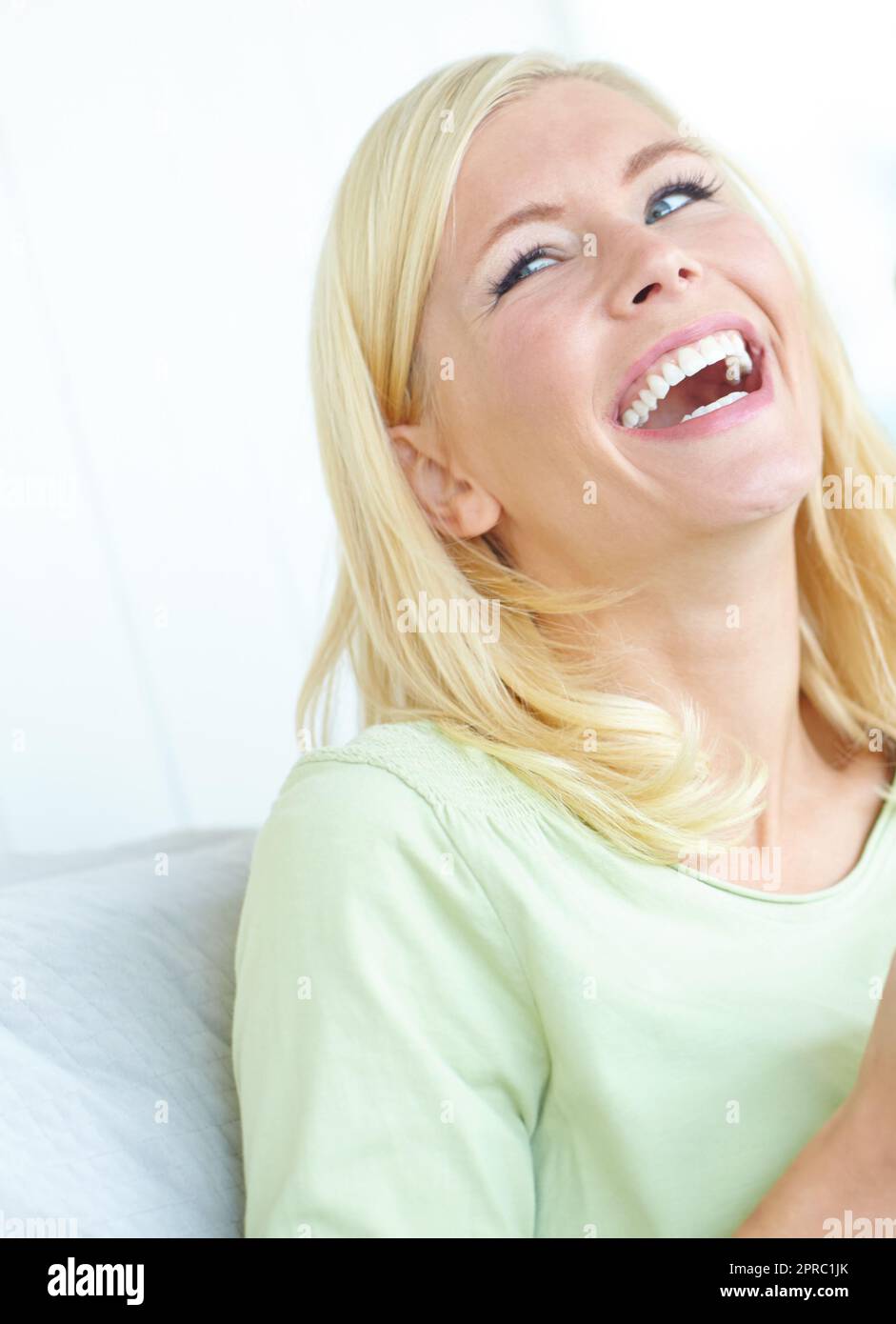 Laughing woman looking away hi-res stock photography and images - Alamy