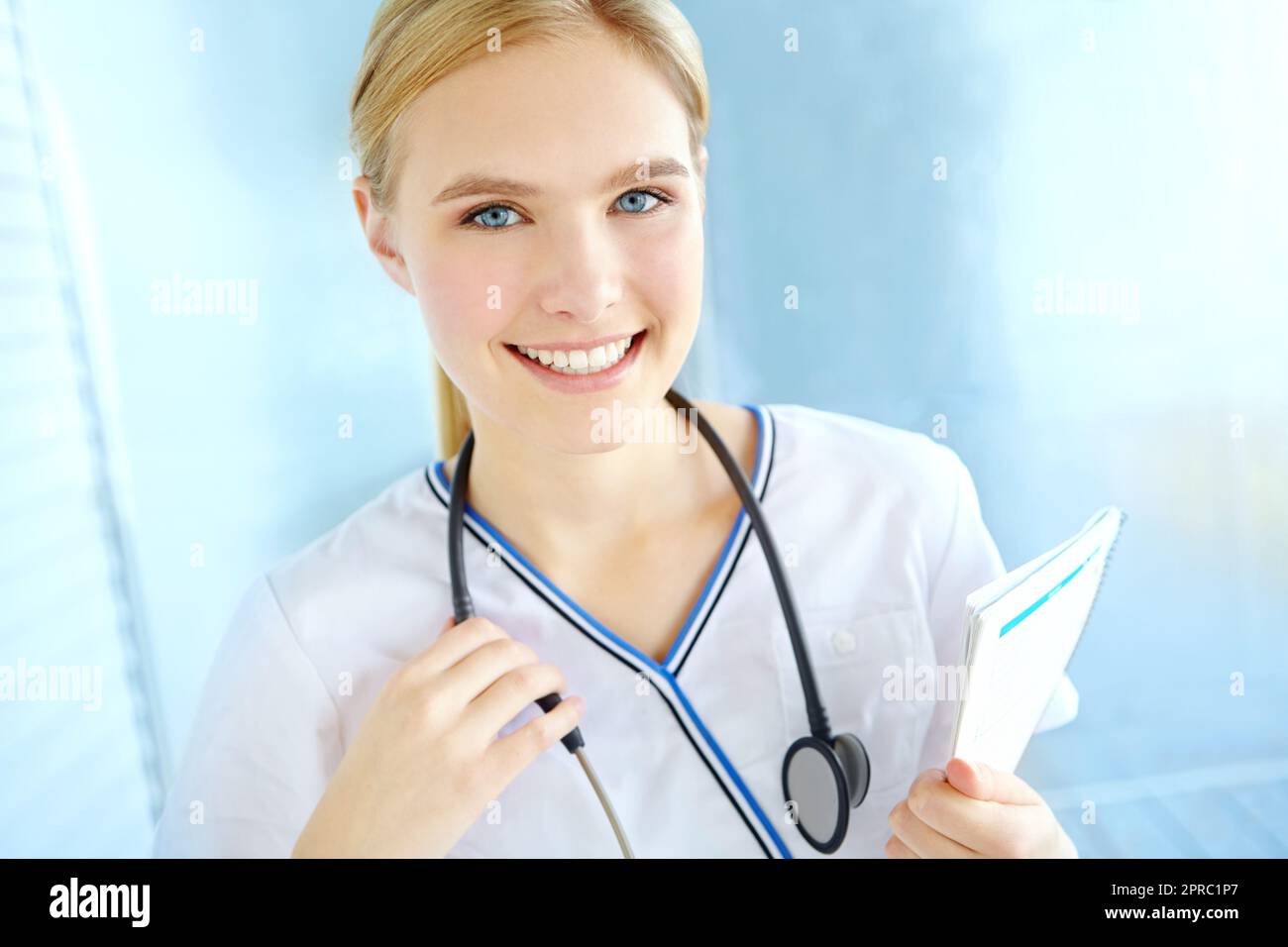 Shes the best medical intern here. Portrait of a pretty nurse with her ...