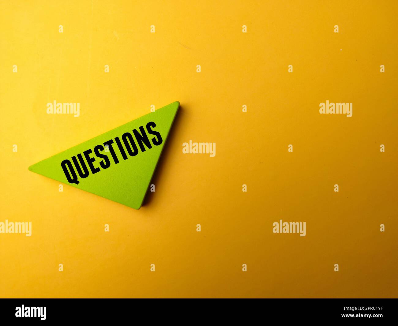 Colored wooden puzzle with the word QUESTION on yellow background Stock ...