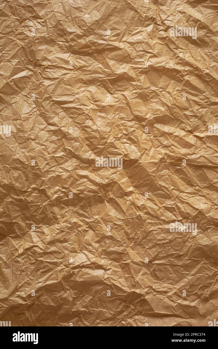 crumpled thin brown paper, brownish tone wrinkled recycle sheet of ...