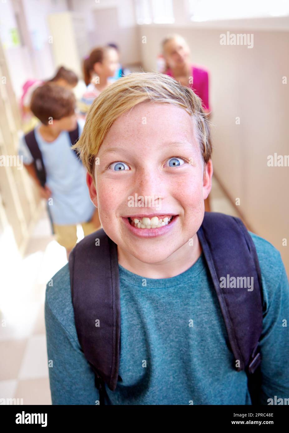 Class clown. Closeup portrait of a young schoolboy pulling a face Stock ...
