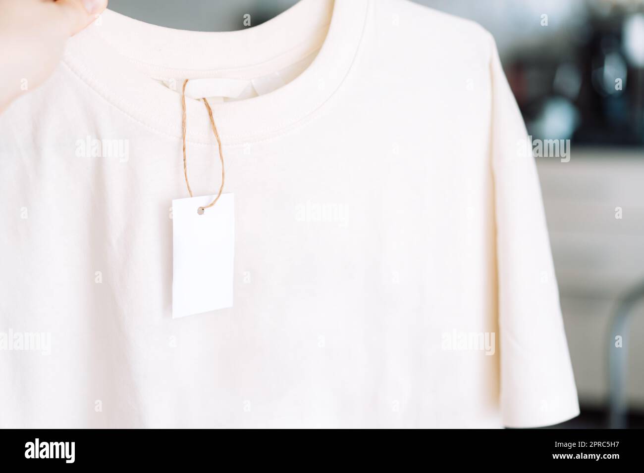 White T-shirt with a white tag without inscriptions Stock Photo - Alamy