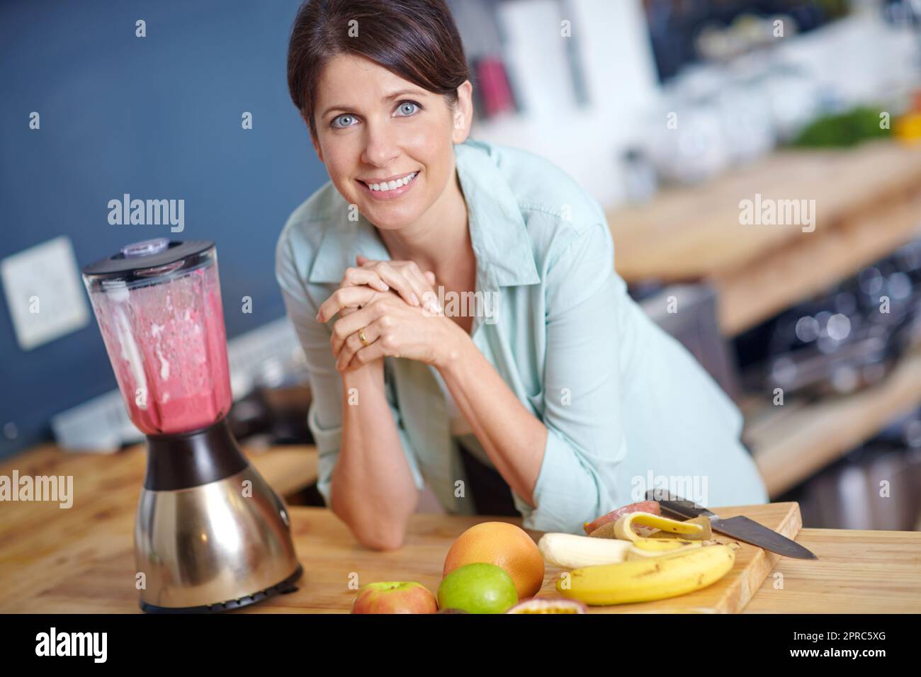 Choose your fruit. Portrait of an attractive woman making a fruit ...