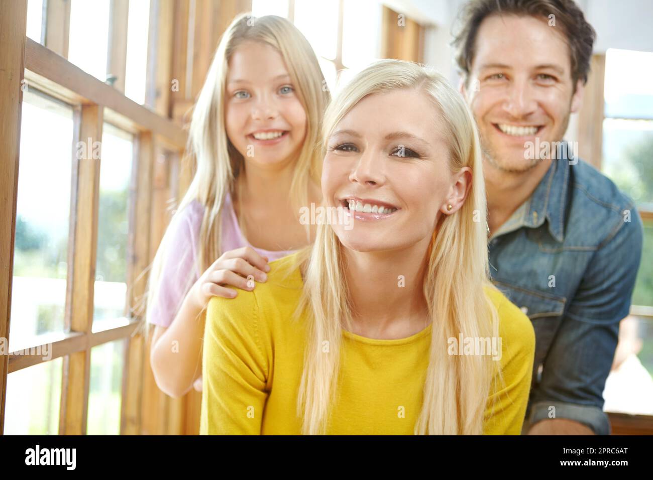 Happiest when theyre together. Portrait of a happy young family bonding ...