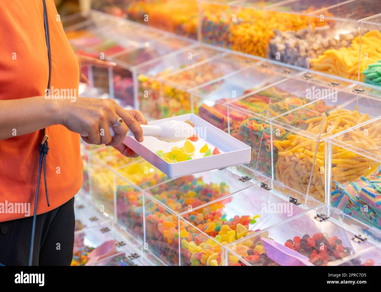 Woman select buying jelly at street food festival Stock Photo - Alamy