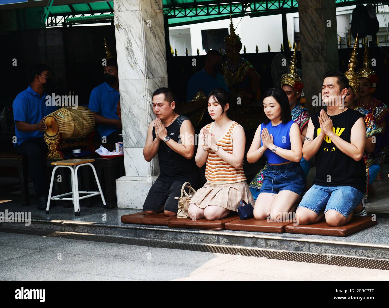 Thai people pray at the Erawan Shrine in Chid Lom, Bangkok, Thailand ...