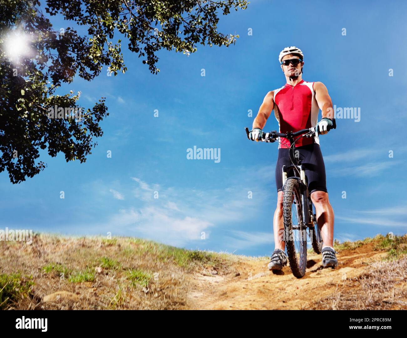 Cycling with a view. Full length shot of a sporty young man standing ...