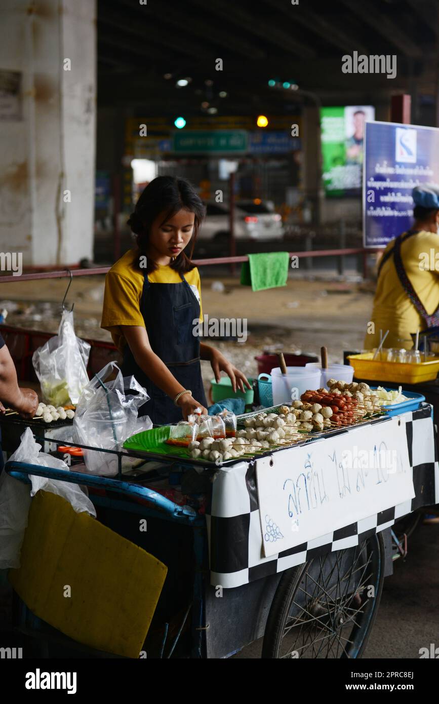 A colorful street food market on the railway track under the Chalerm ...