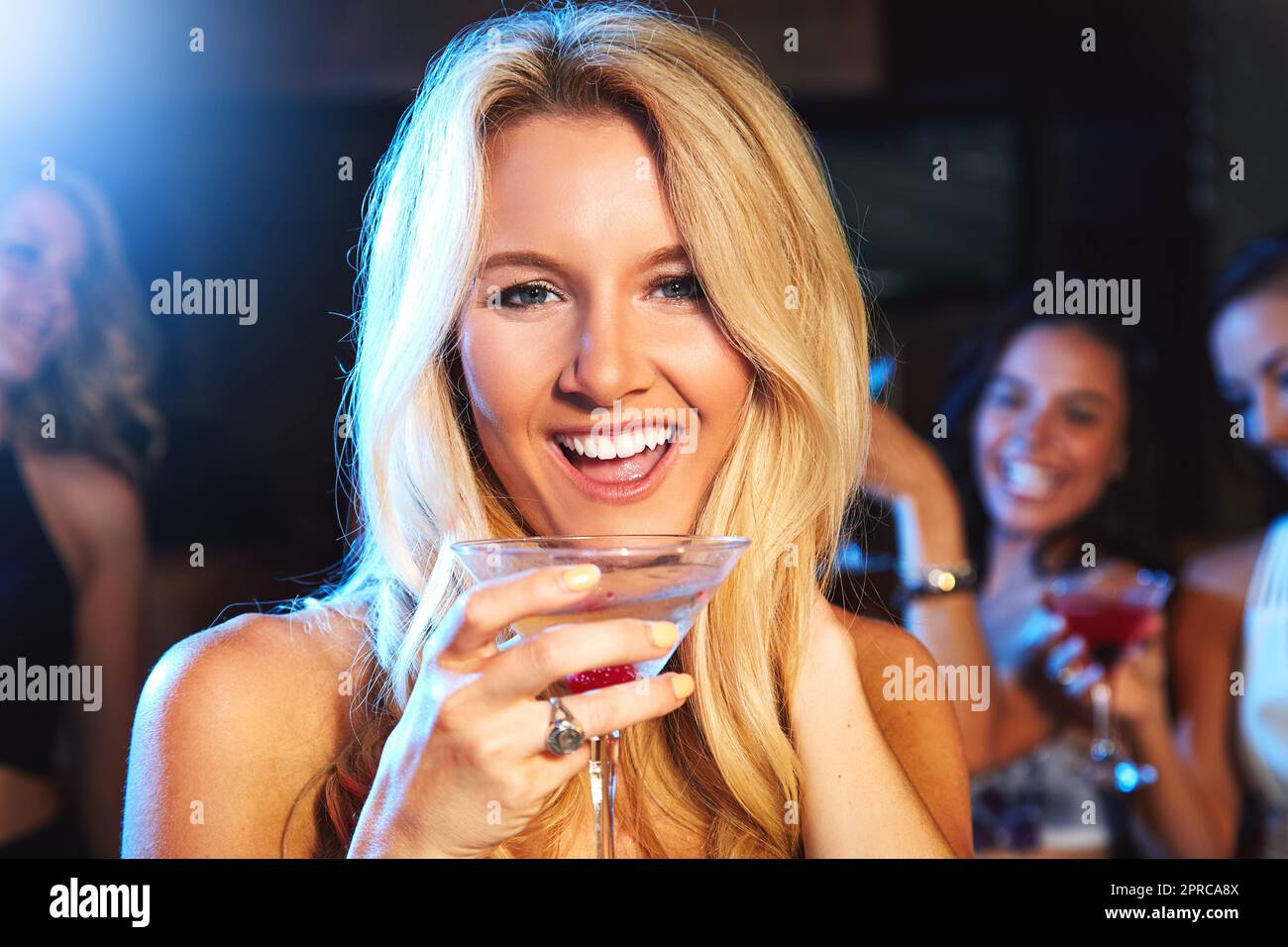 Feeling the vibe. a young woman partying in a nightclub Stock Photo - Alamy