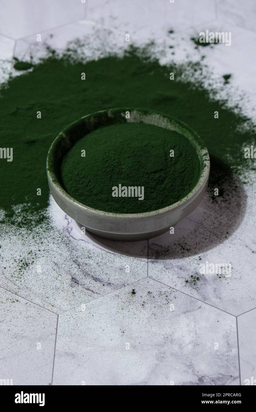 Blue-green algae Chlorella and spirulina powder in bowl. Super powder ...