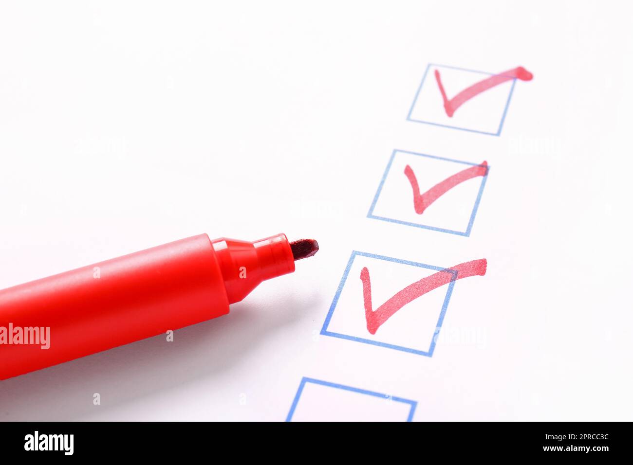 Checklist box with marks and red marker, closeup Stock Photo - Alamy