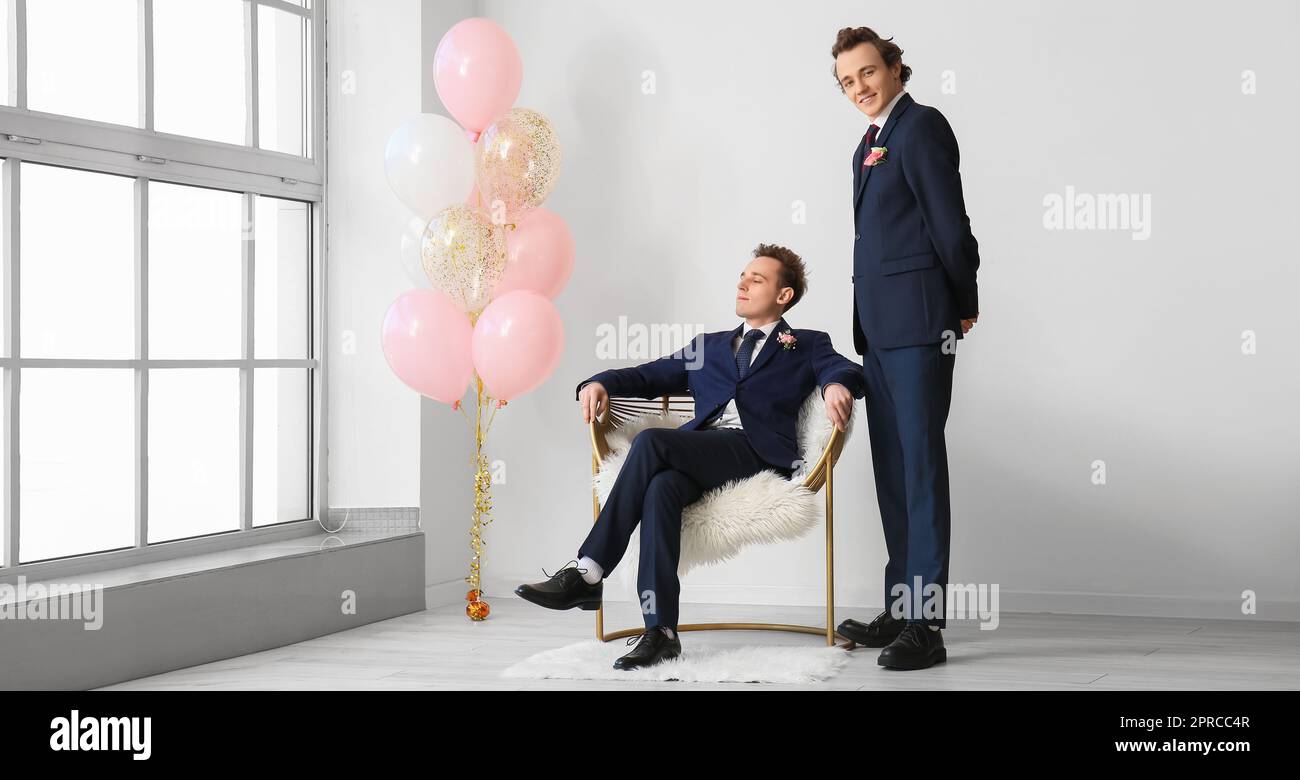 Teenage boys dressed for prom party in room Stock Photo - Alamy