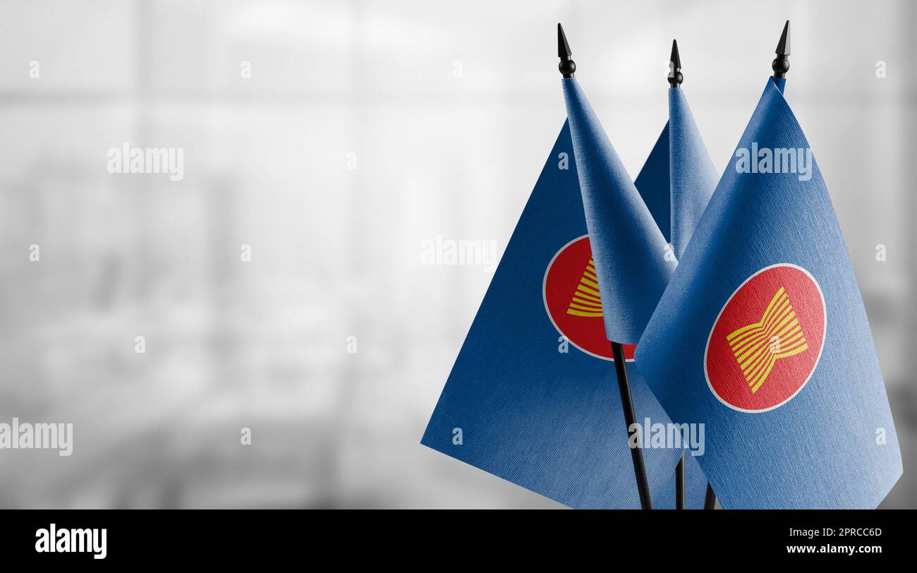 Small flags of the ASEAN on an abstract blurry background Stock Photo ...