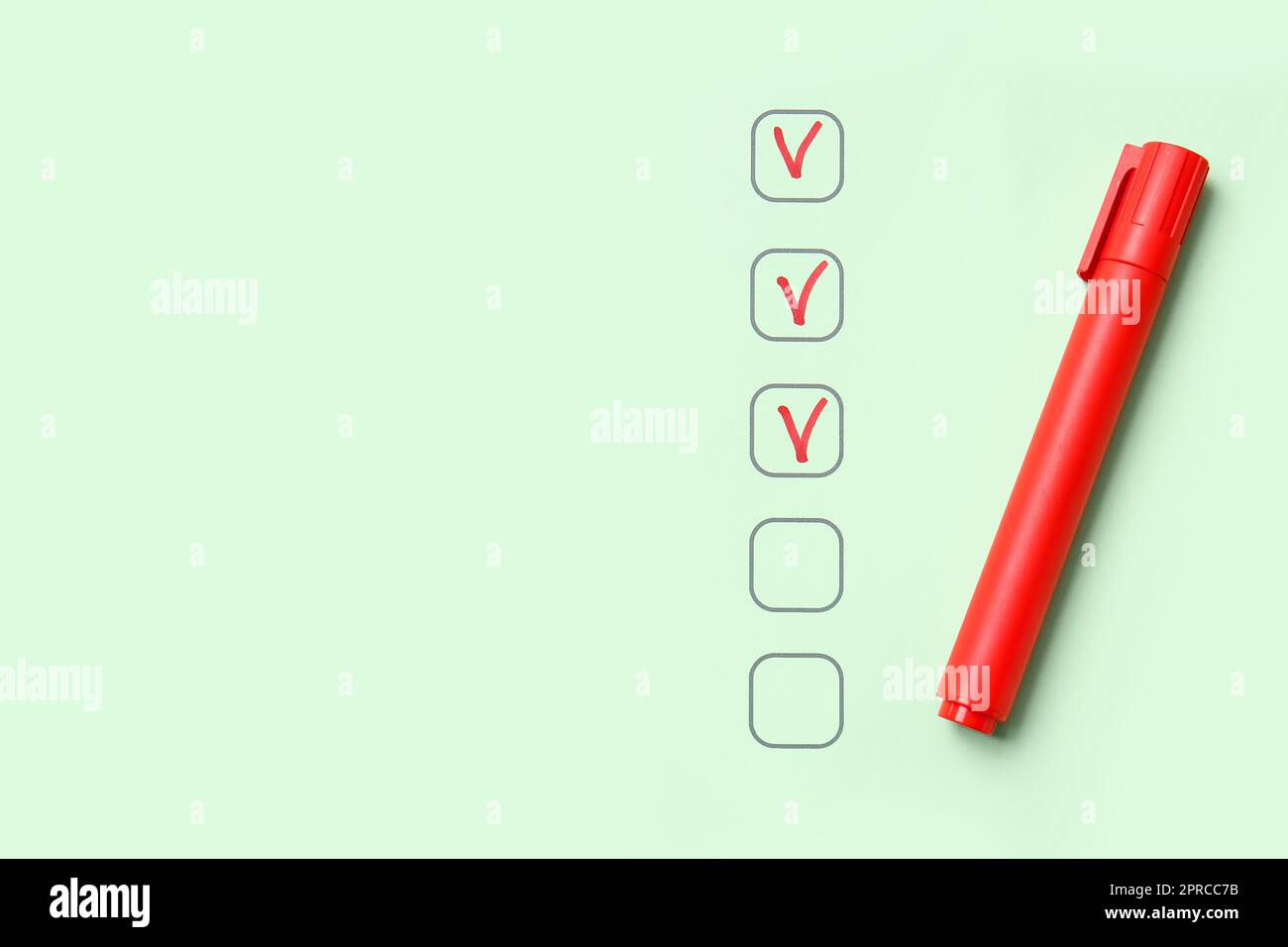 Checklist box with red marker, closeup Stock Photo - Alamy