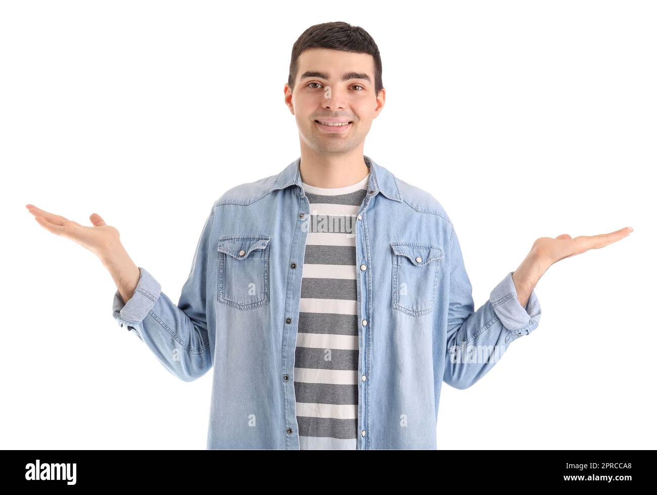 Young man balancing on white background Stock Photo - Alamy