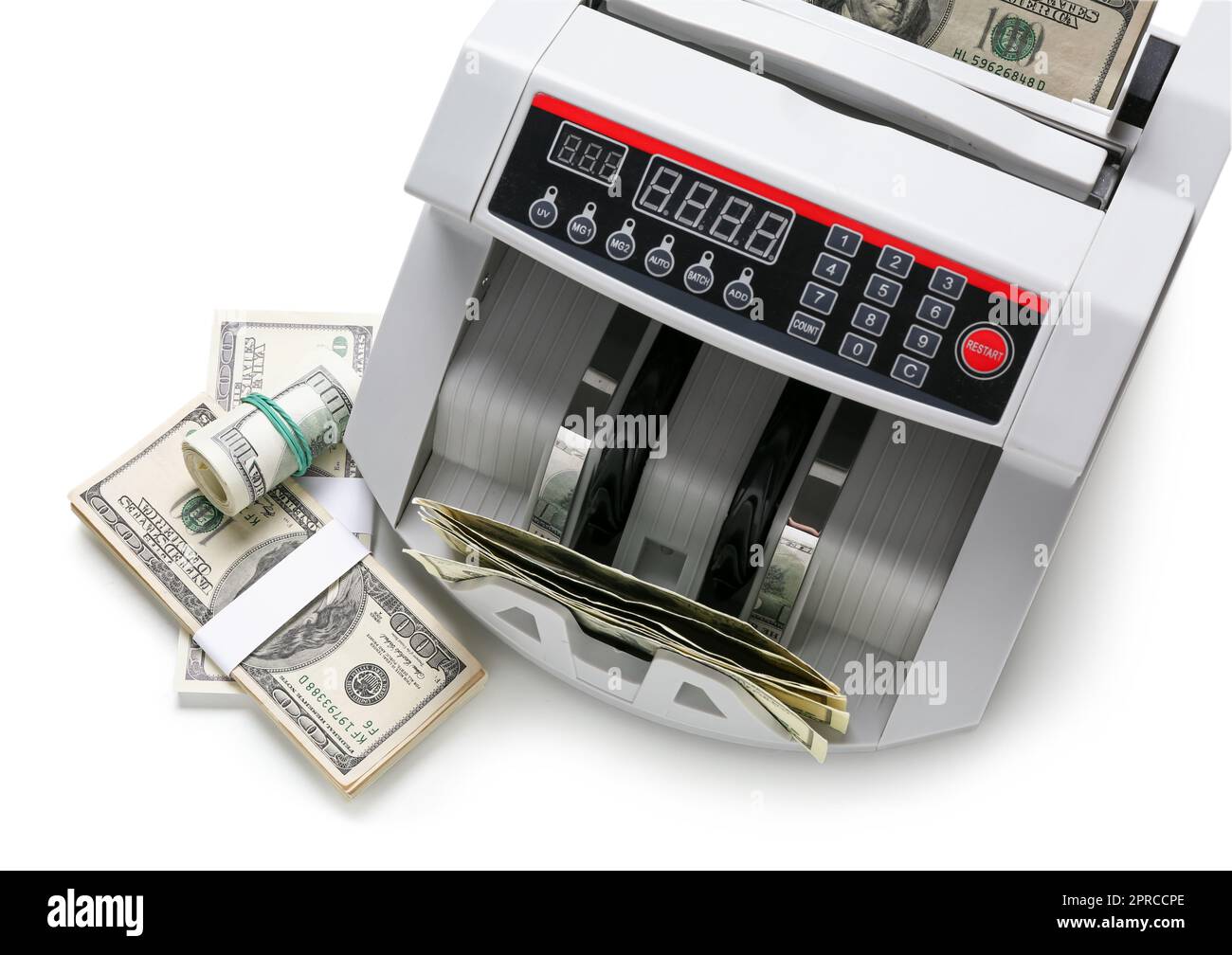 Modern cash counting machine with dollar banknotes on white background ...