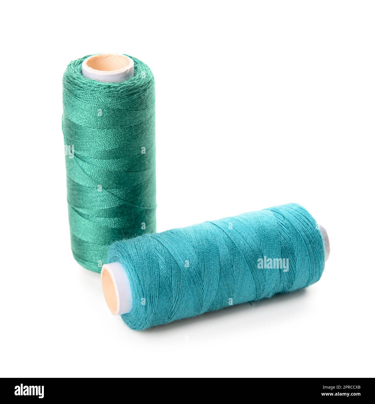 Sewing threads isolated on white background Stock Photo - Alamy