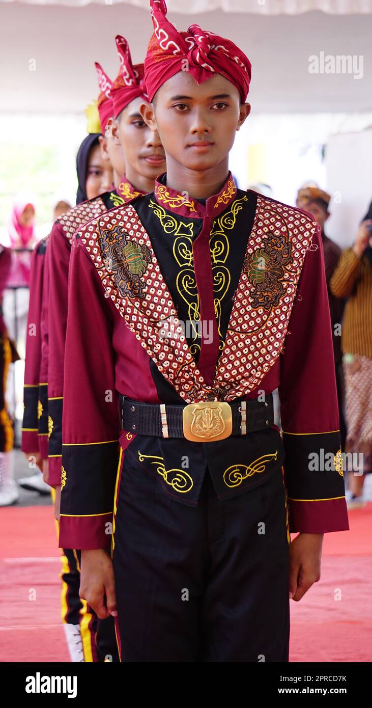 Indonesian senior high school students with batik uniforms, marching to ...