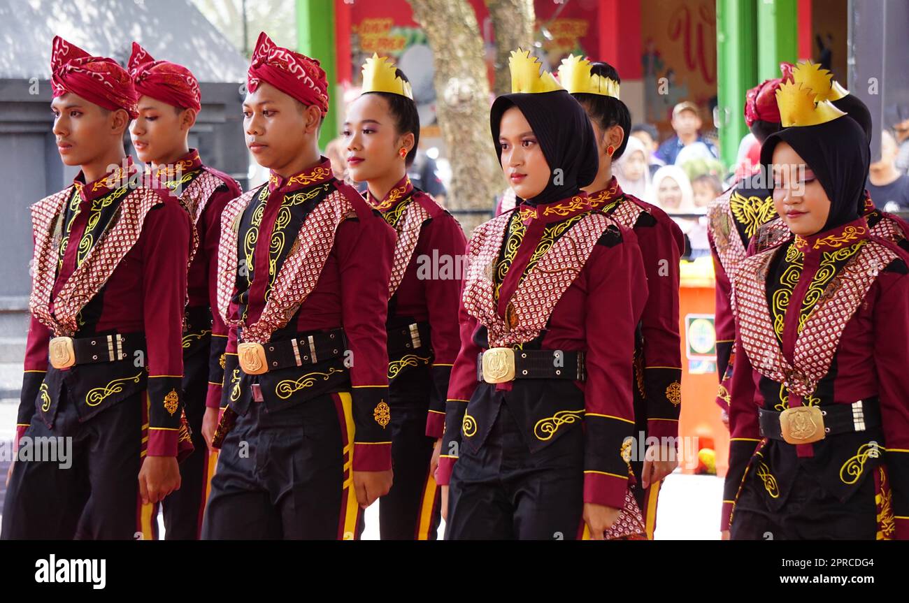 Indonesian senior high school students with batik uniforms, marching to ...