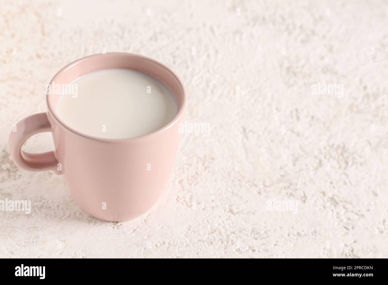 Cup with fresh milk on white background Stock Photo - Alamy
