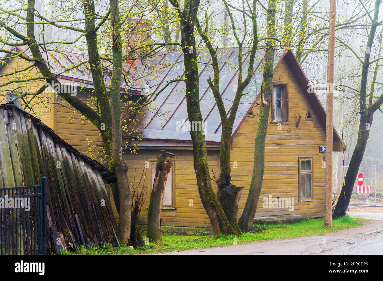 Old yellow painted wooden house by the Jänese street in Tartu Estonia ...
