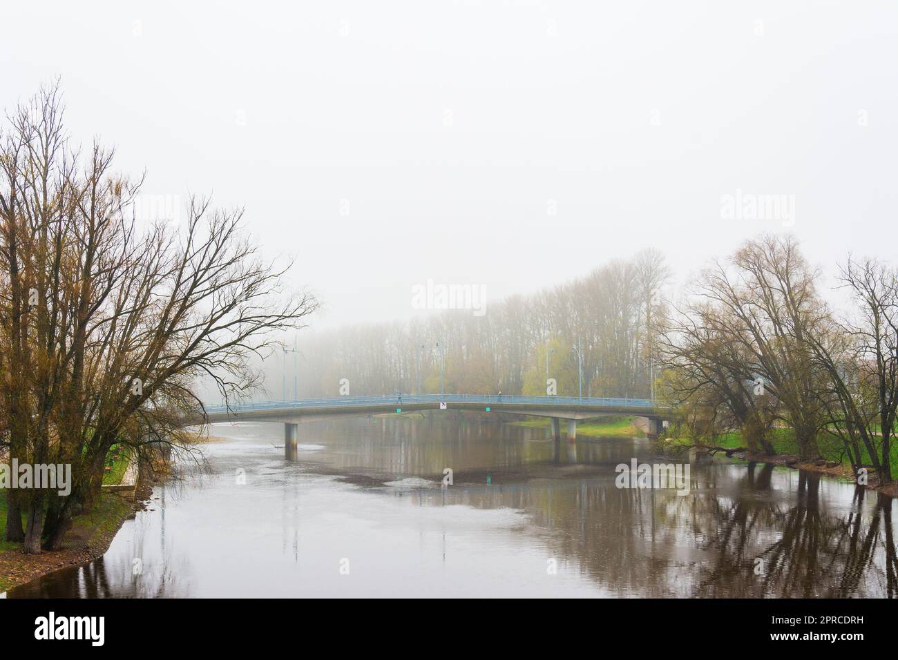 Bridge over Emajogi river in misty morning in Tartu Estonia Stock Photo ...