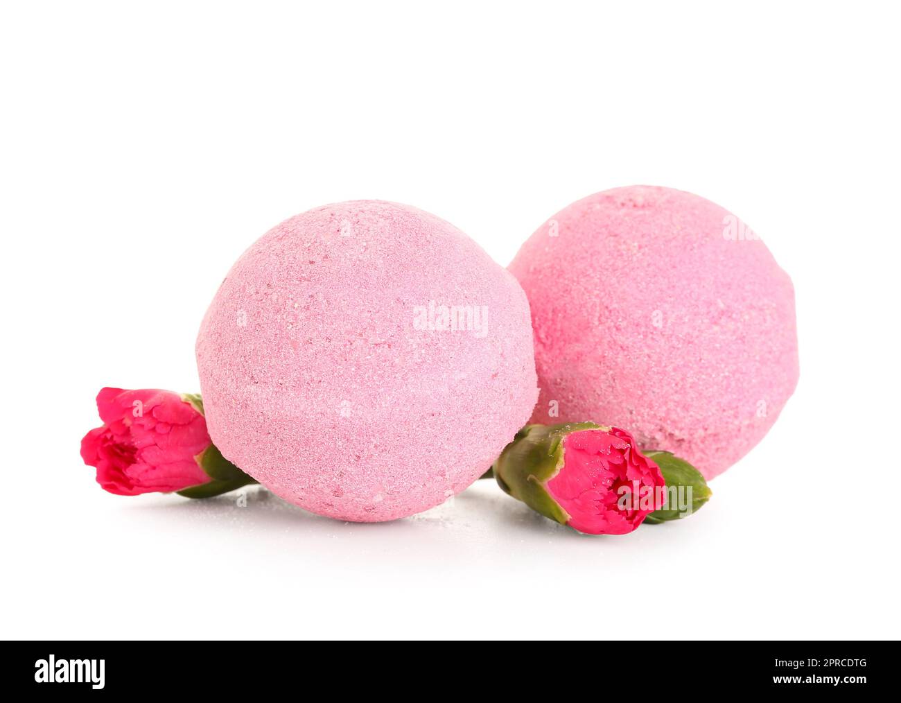 Pink bath bombs with flowers on white background Stock Photo - Alamy