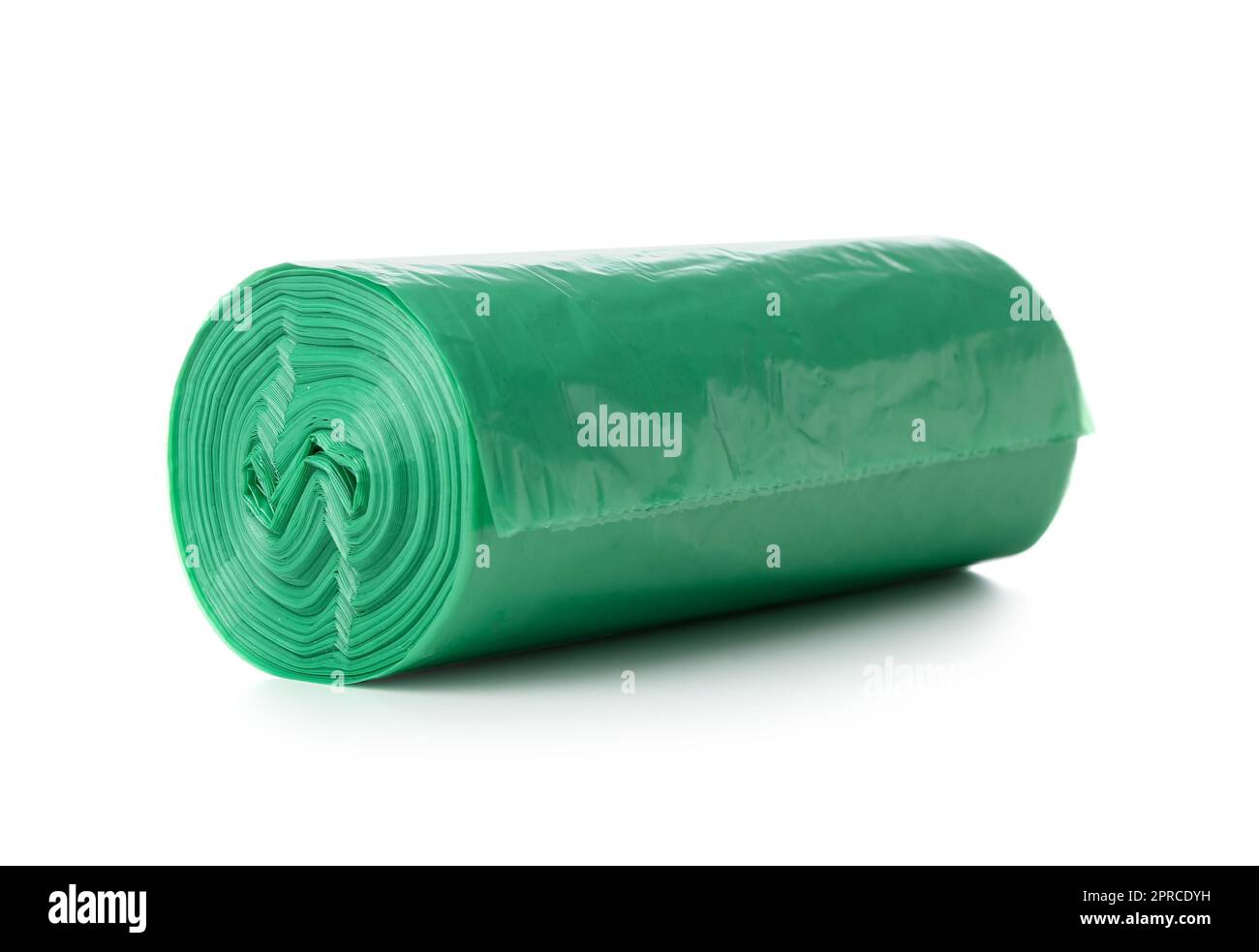 Green roll of garbage bags on white background Stock Photo - Alamy